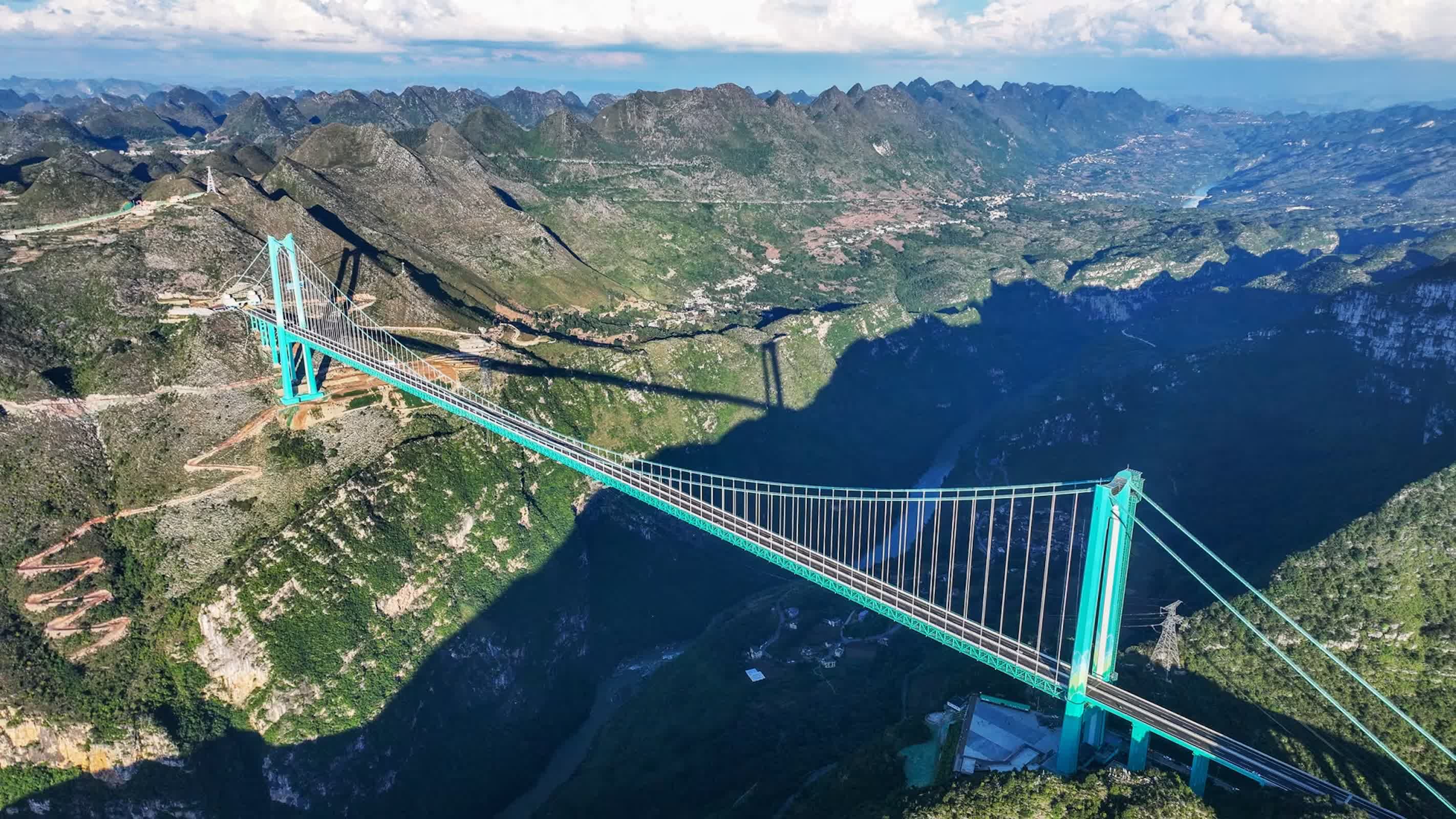 World's tallest bridge debuts in China, soaring 2,000 feet above a ...