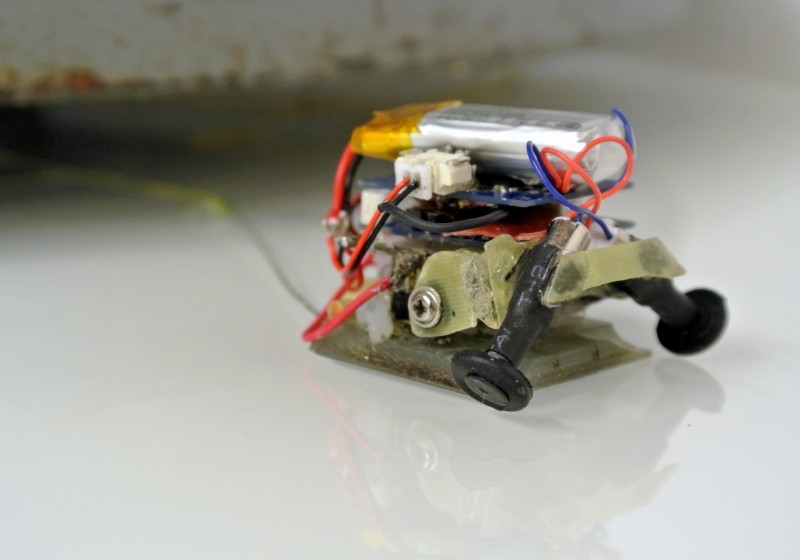 Watch this video of six tiny robots working together to pull a 2-ton ...