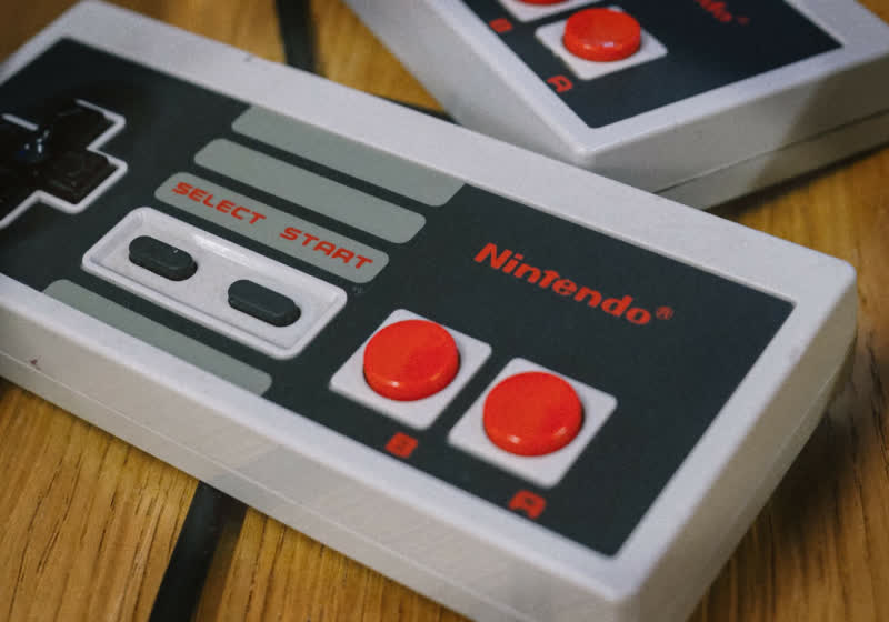 Palm-sized NES clone plays classic cartridges using the same chips that ...