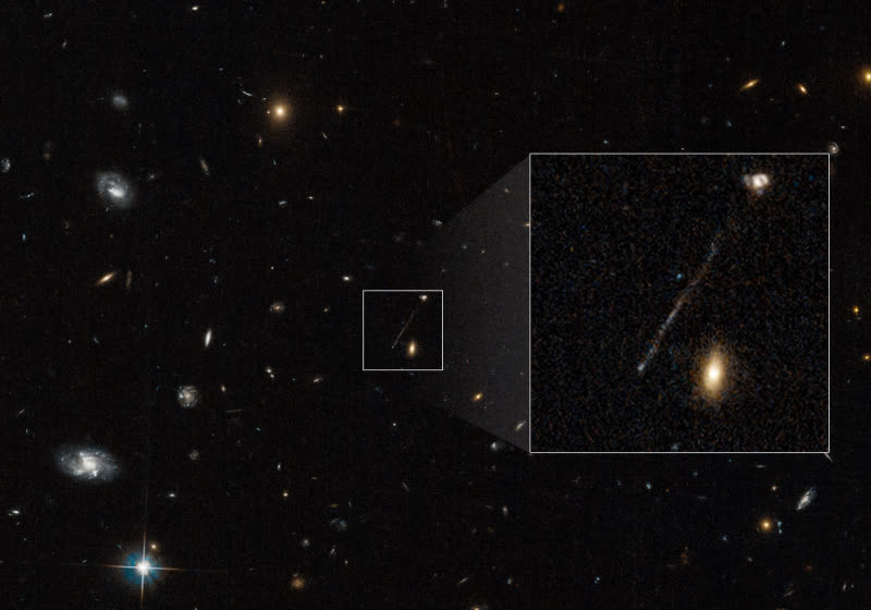 This supermassive black hole is leaving a trail of new stars in its ...